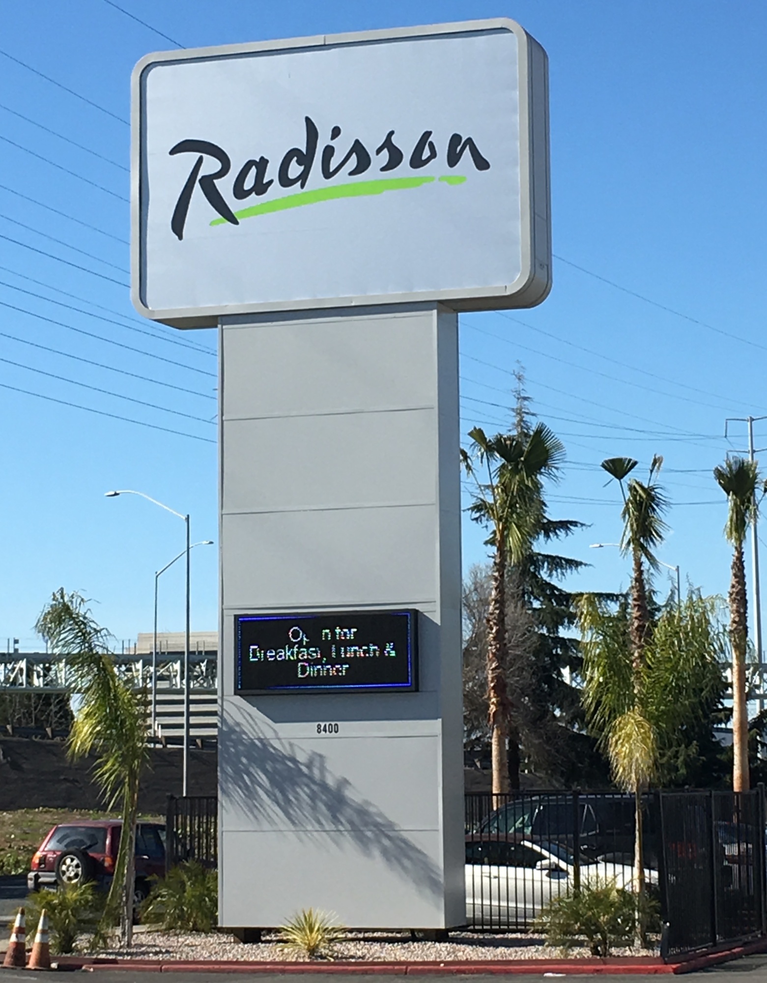 Signage and Car Wrap for Radisson Hotel – Custom Vehicle Wraps